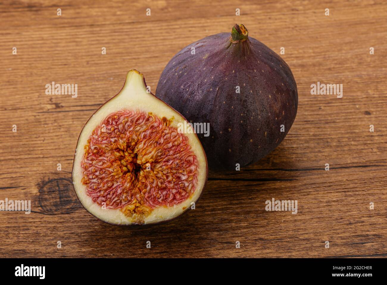 Sweet purple slice of fig fruit Stock Photo - Alamy