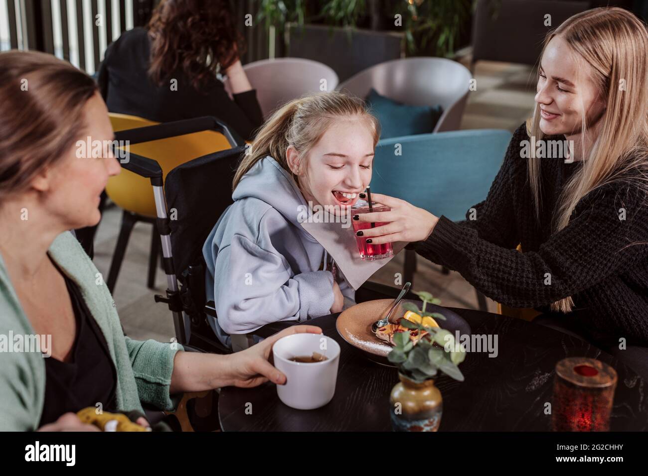 Family in cafe Stock Photo - Alamy