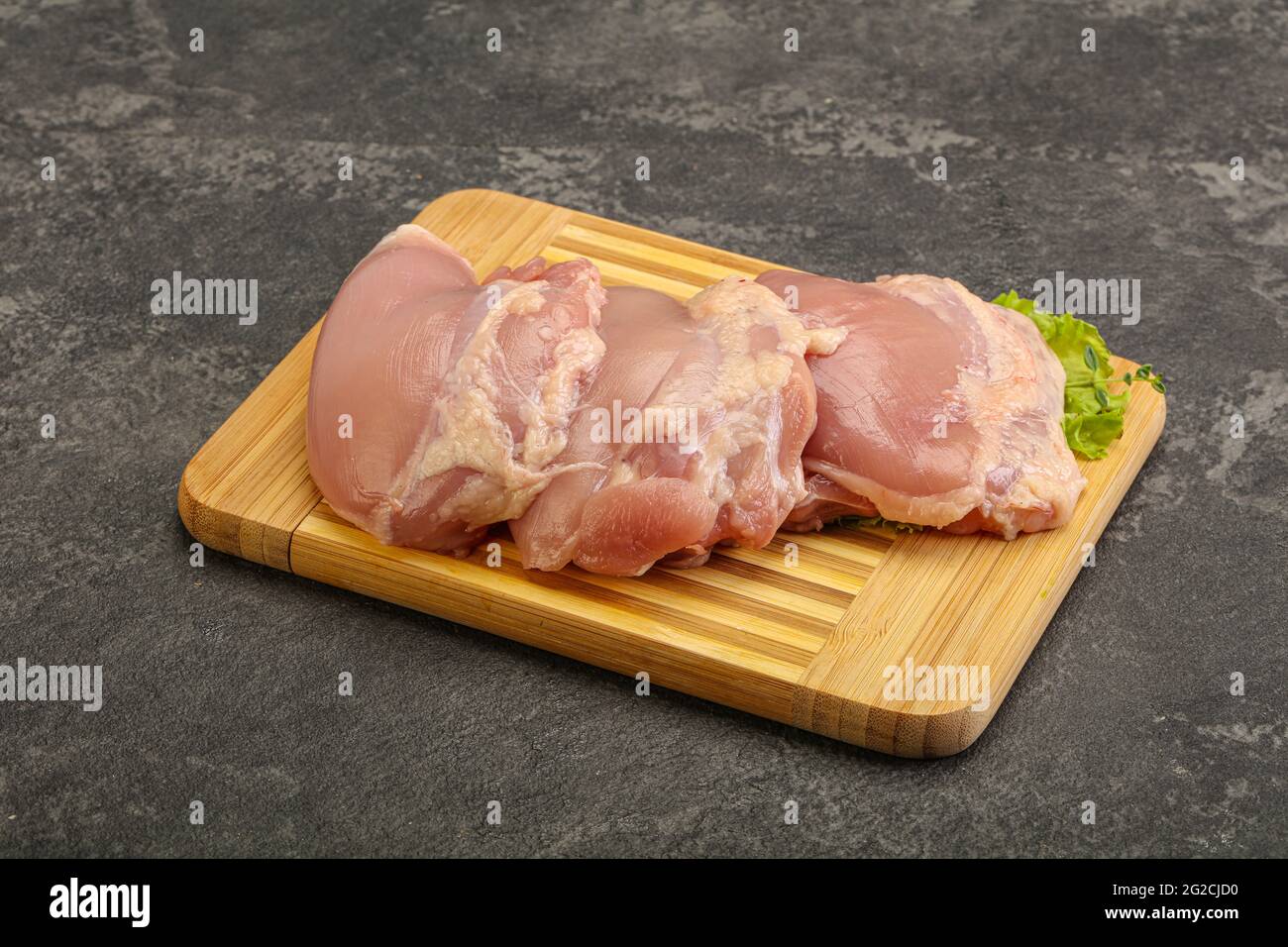 Raw chicken boneless and skinless leg for cooking Stock Photo - Alamy