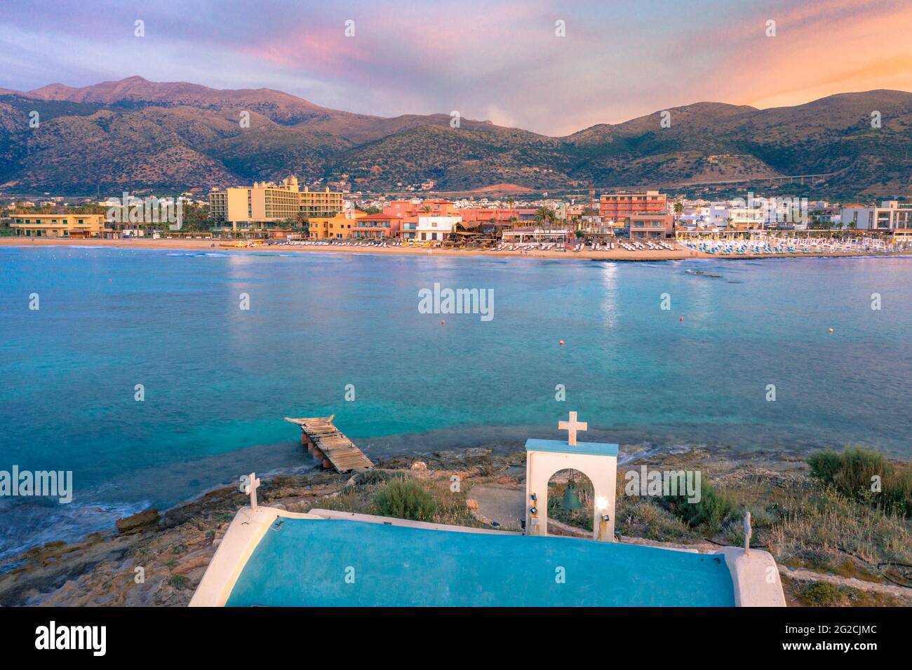 An old white church in a small island at sunset in Malia, Crete, Greece ...