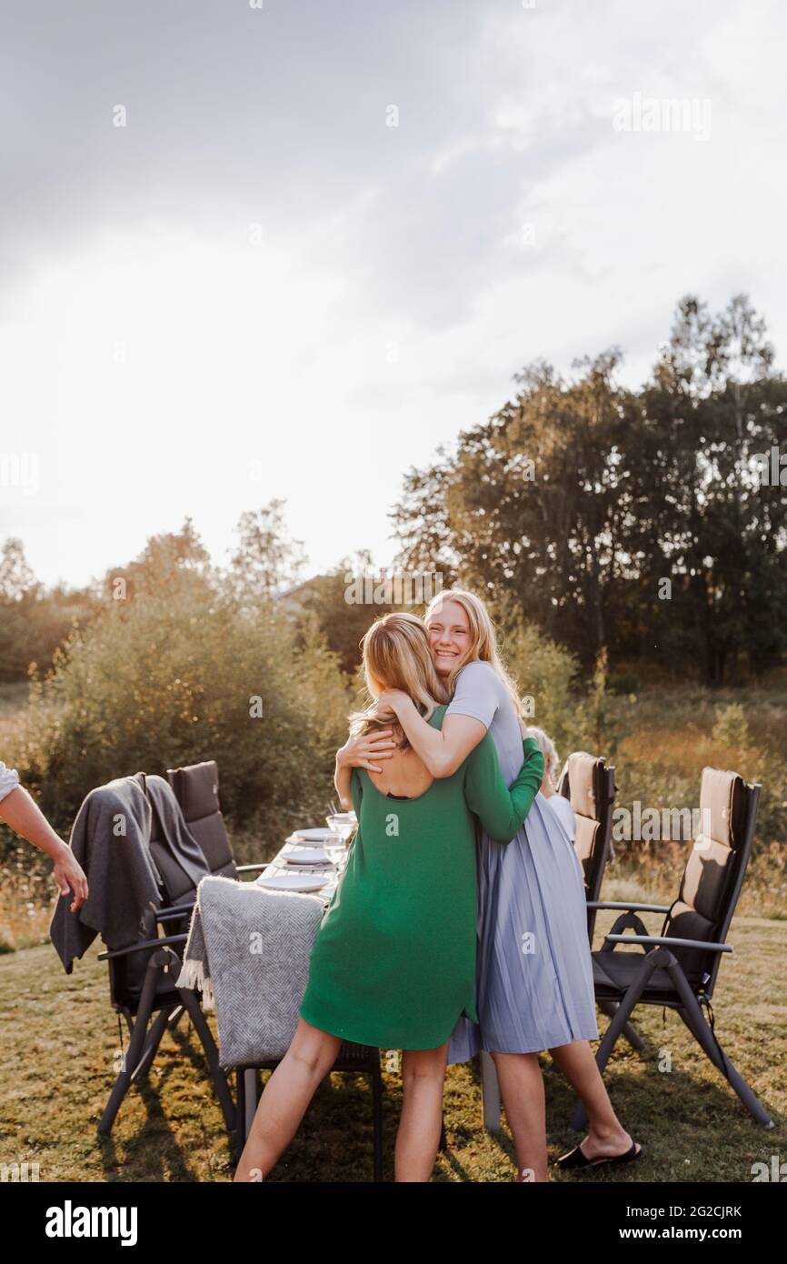 Friends during garden party Stock Photo - Alamy