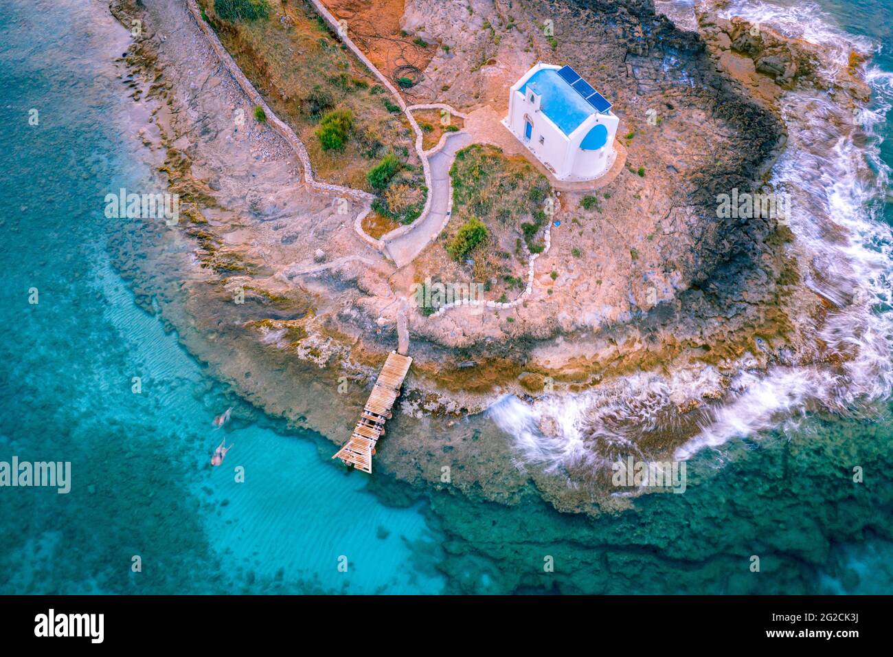 An old white church in a small island at sunset in Malia, Crete, Greece ...