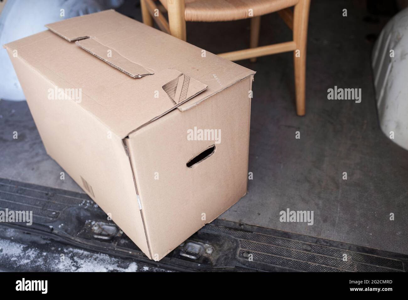 Cardboard box in van Stock Photo - Alamy