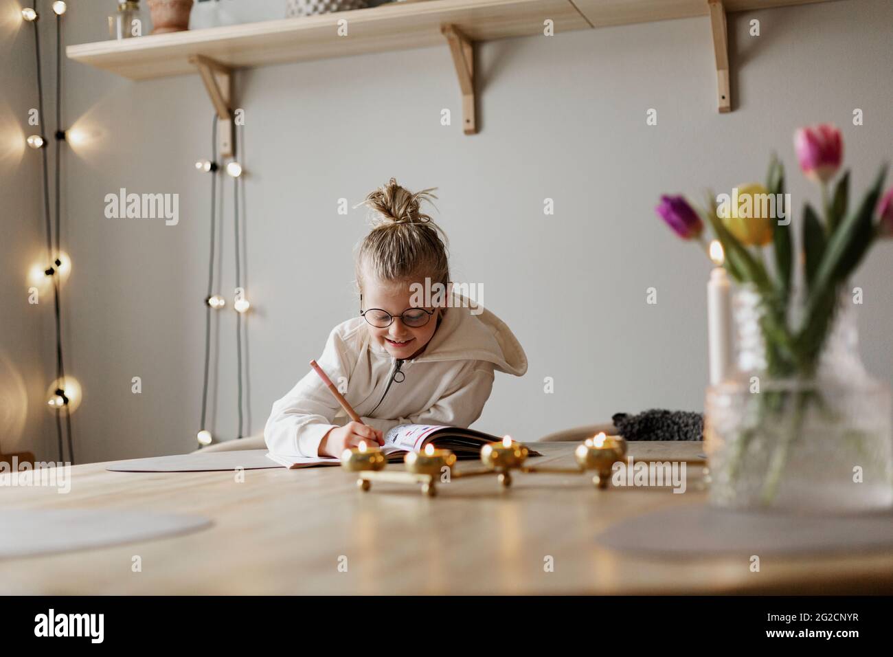 Girl doing homework Stock Photo - Alamy
