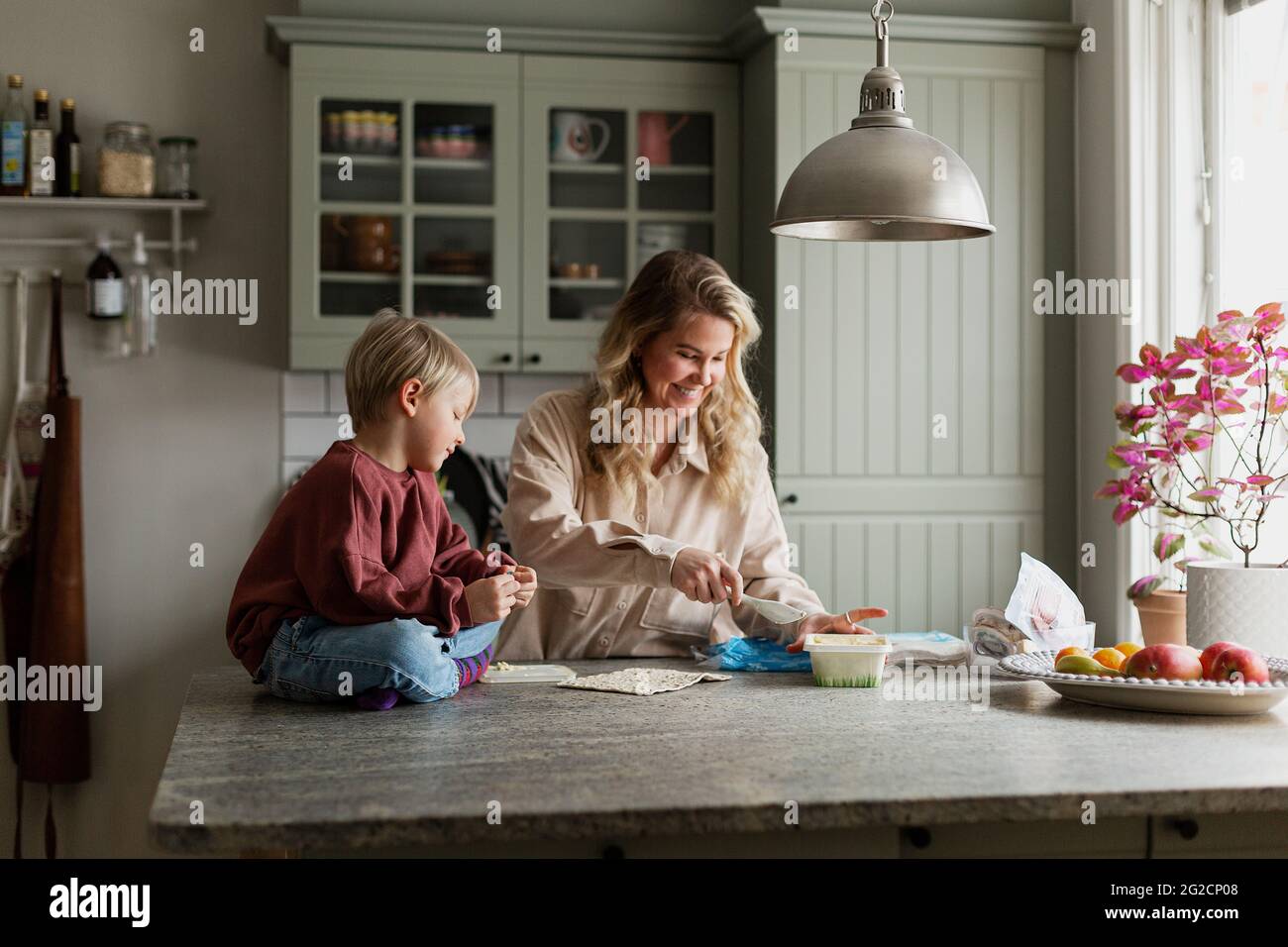 Daughter and son cooking in kitchen hi-res stock photography and images ...
