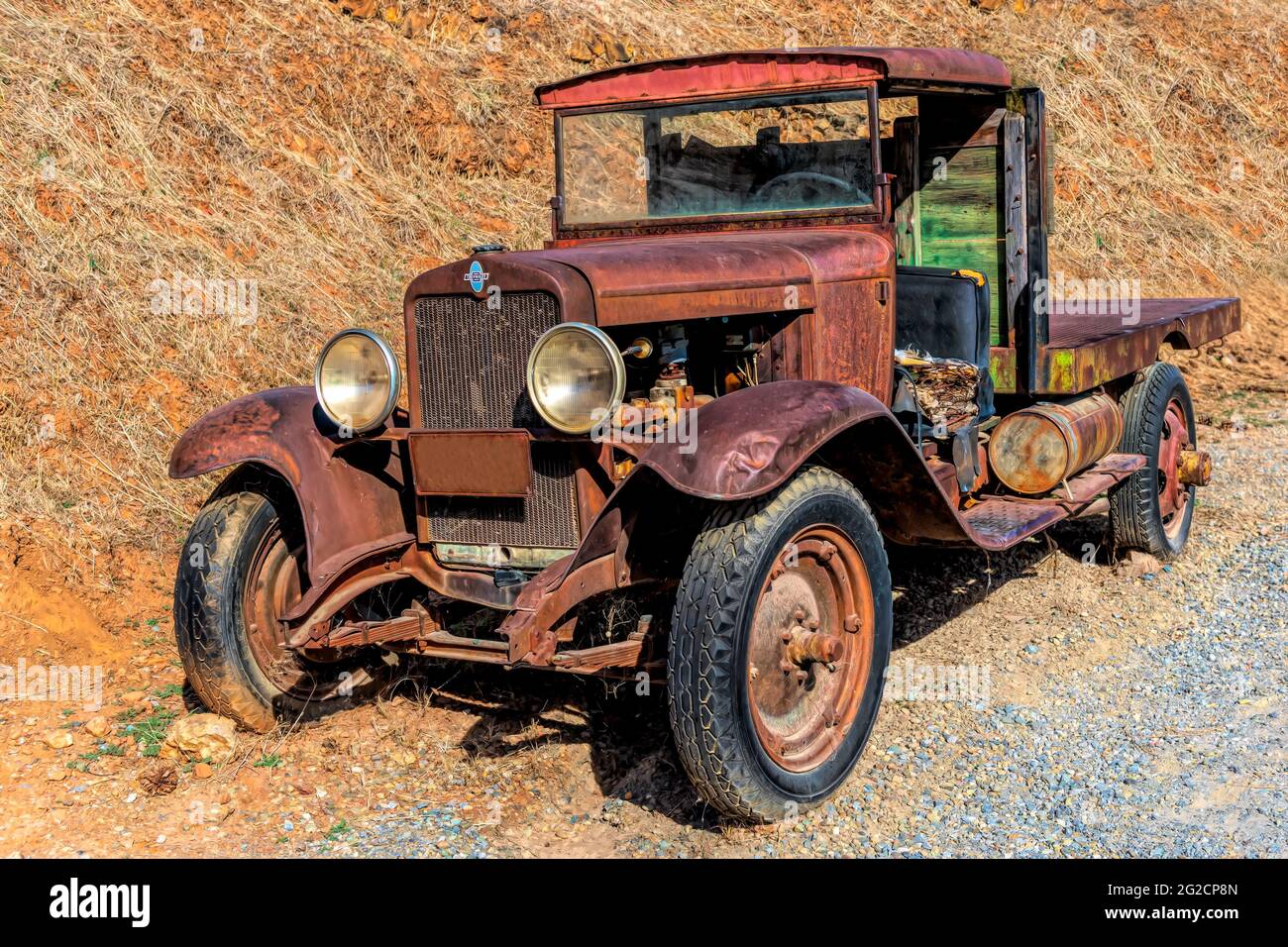 Old Chevrolet truck, rusted, classic, in the field, missing the doors ...