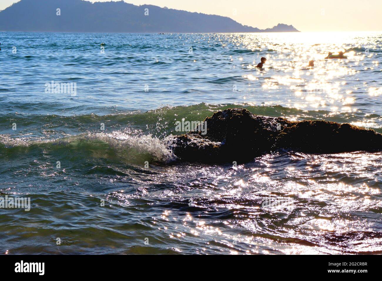 Heat at sea, waves glisten in the sun, beach vacation Stock Photo - Alamy