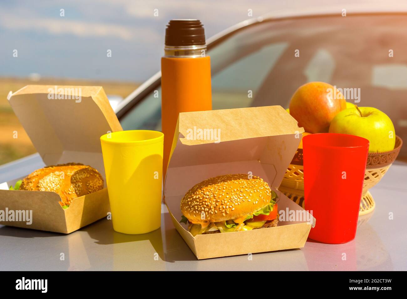Lunch in nature on the hood of car after a long trip Stock Photo - Alamy