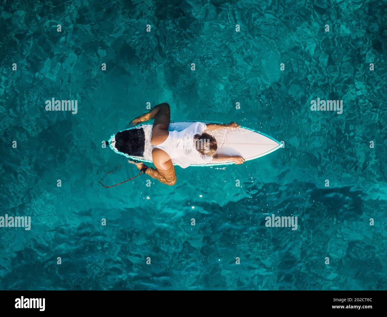 Surfer girl relaxing on surfboard hi-res stock photography and images ...