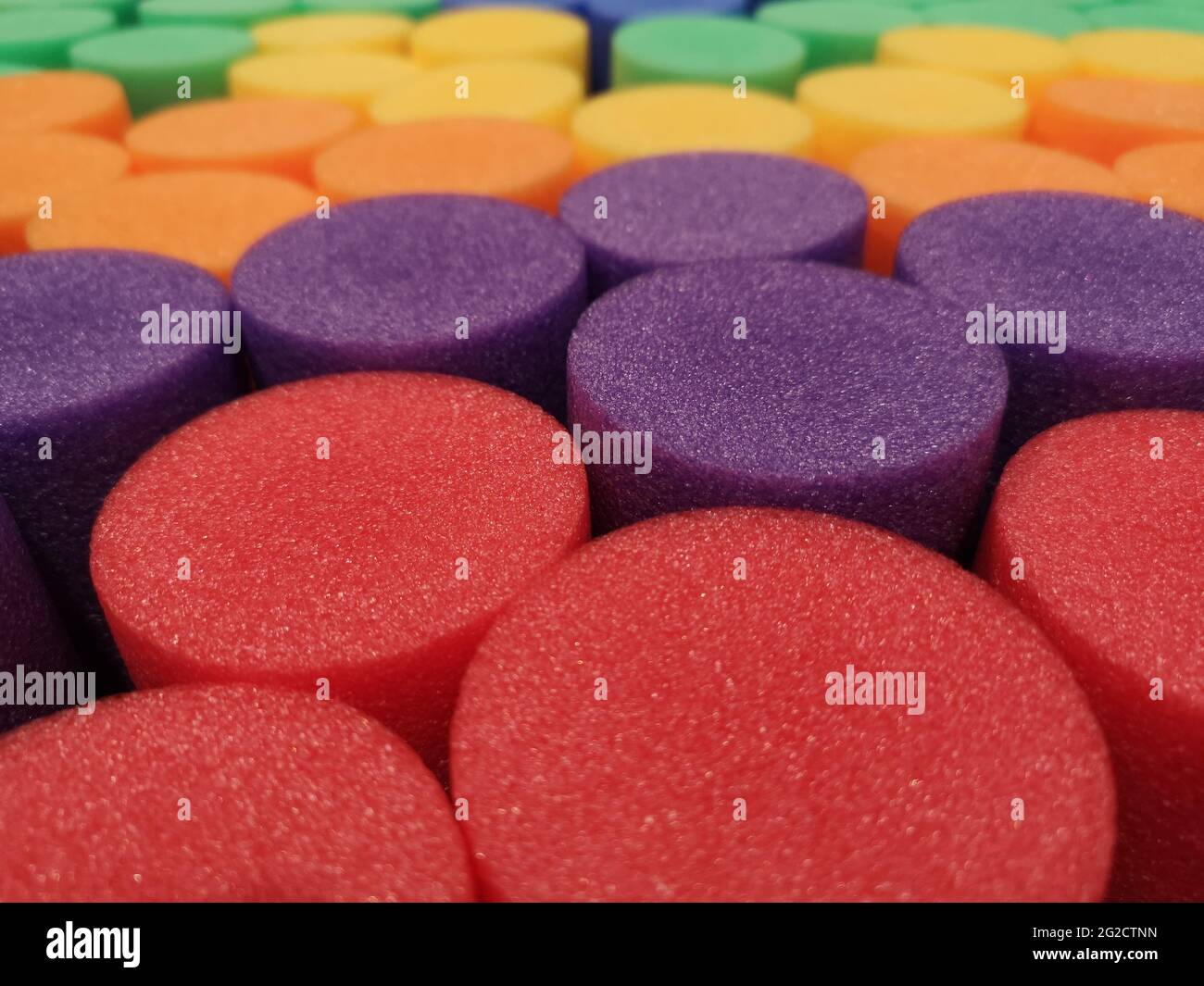 Closeup shot of colorful floating bars used for learning to swim in the ...