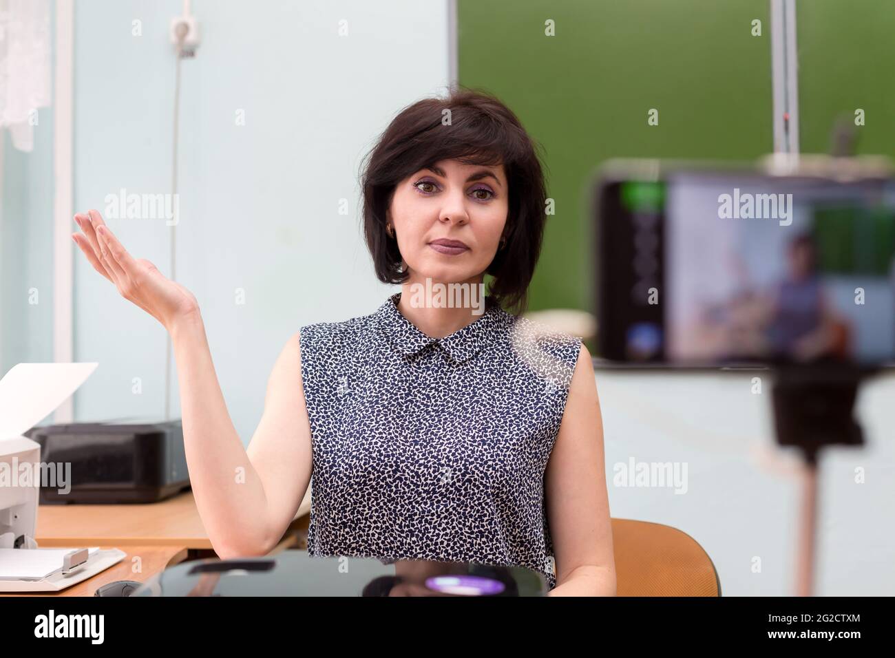 The teacher conducts distance learning at school online broadcast of ...