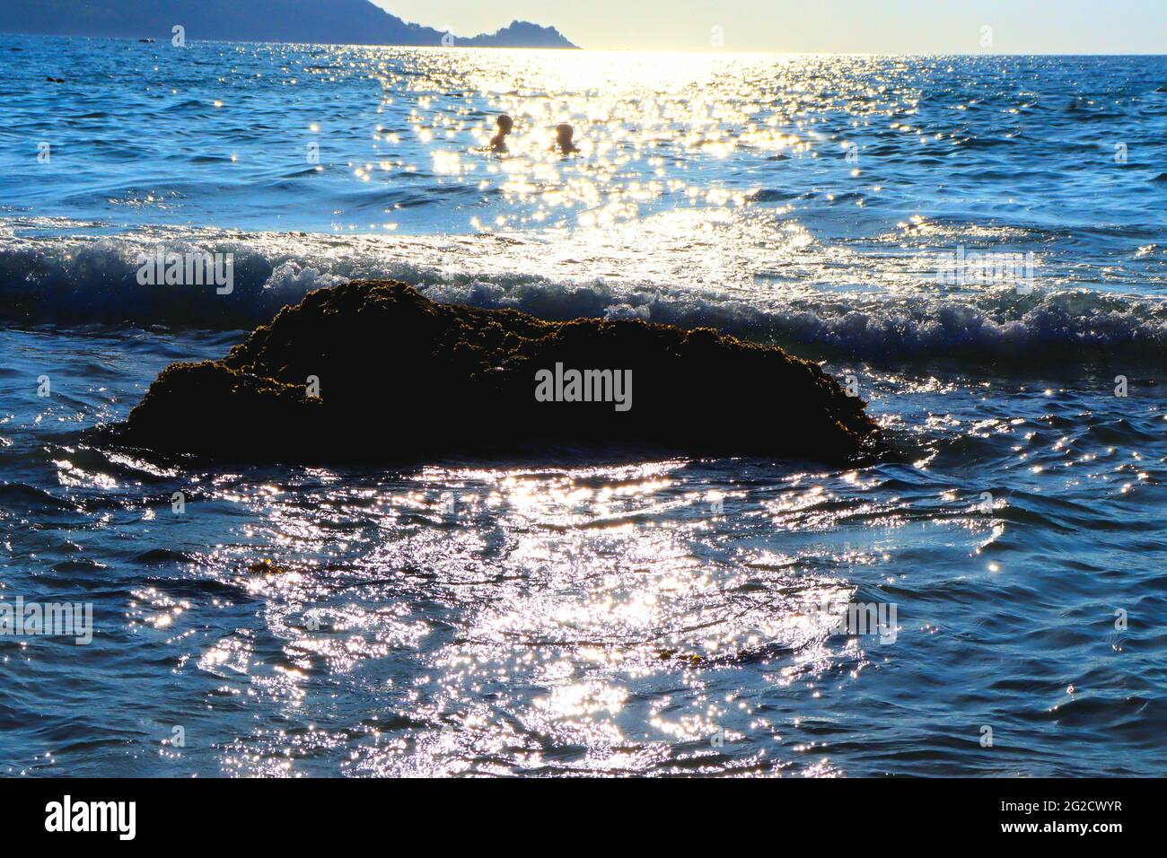 Heat at sea, waves glisten in the sun, beach vacation Stock Photo - Alamy