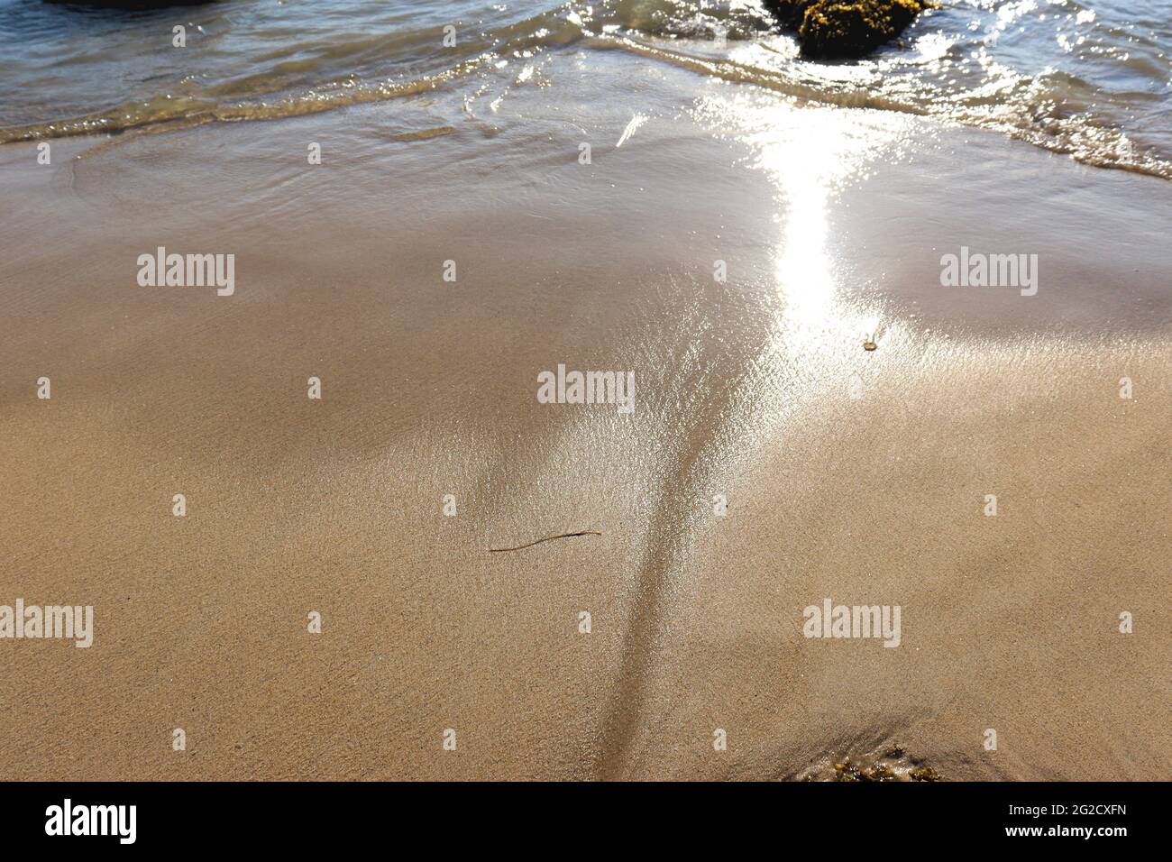 Heat at sea, waves glisten in the sun, beach vacation Stock Photo - Alamy