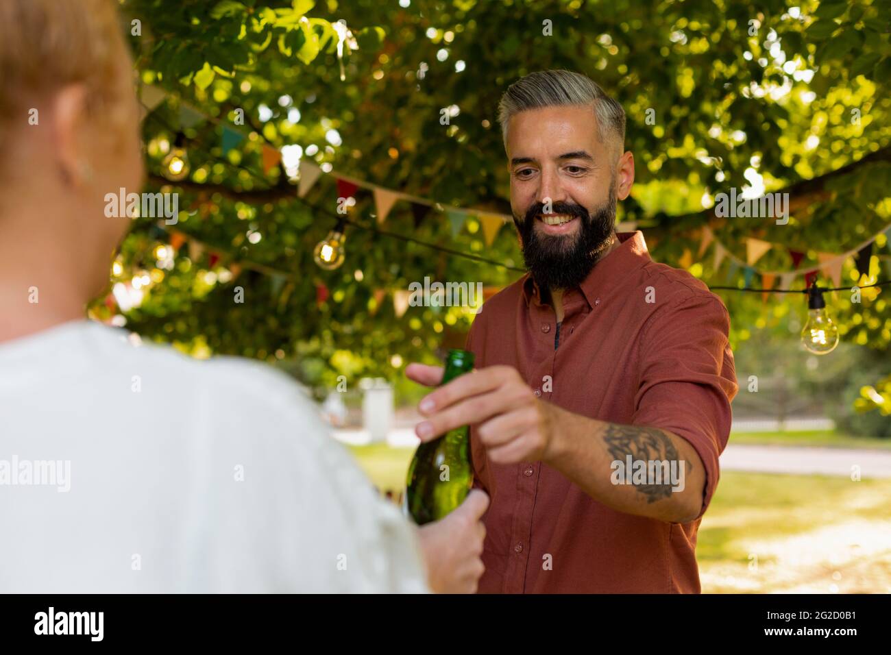 Woman passing drink hi-res stock photography and images - Alamy