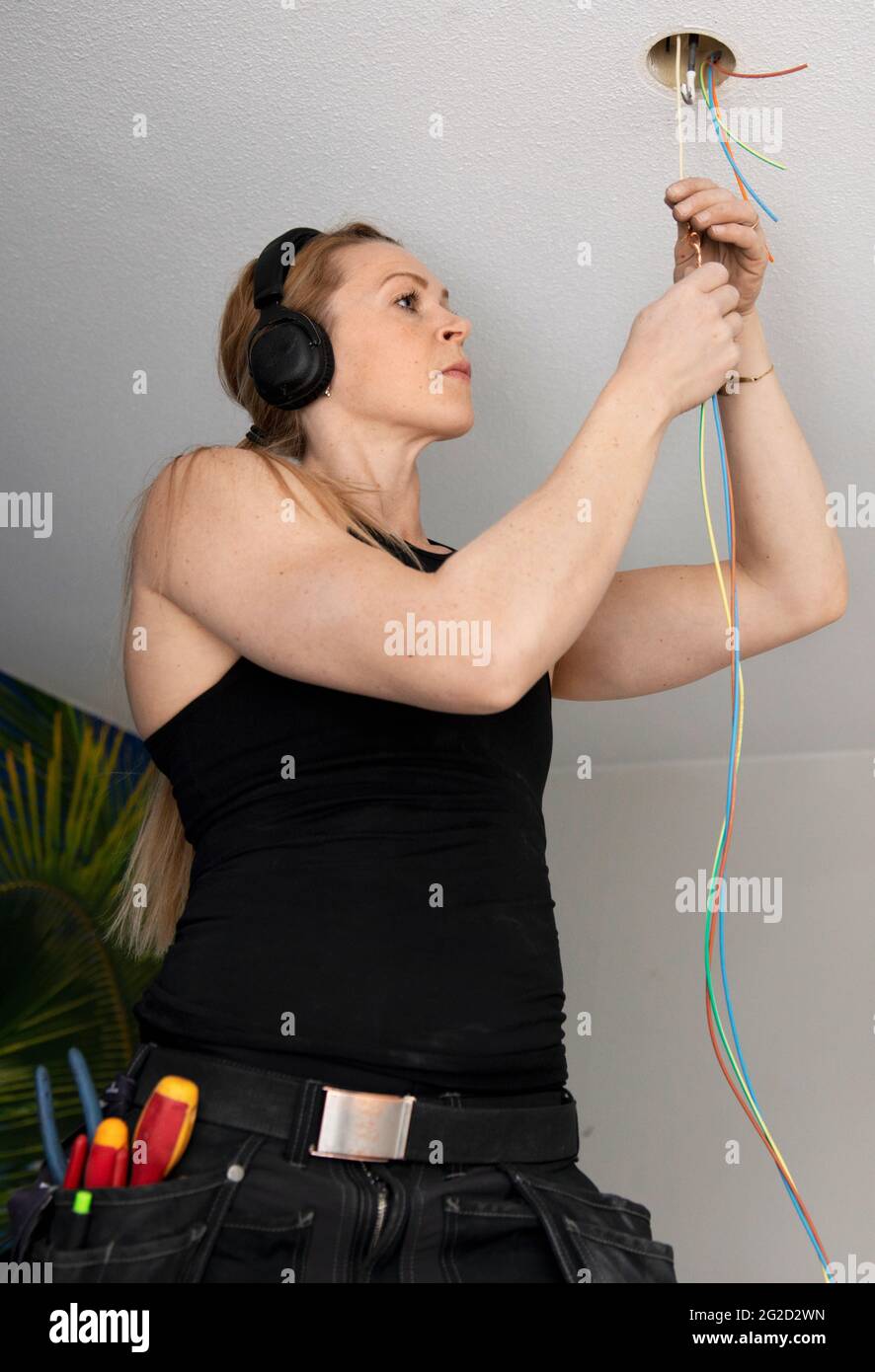 Female electrician at work Stock Photo - Alamy