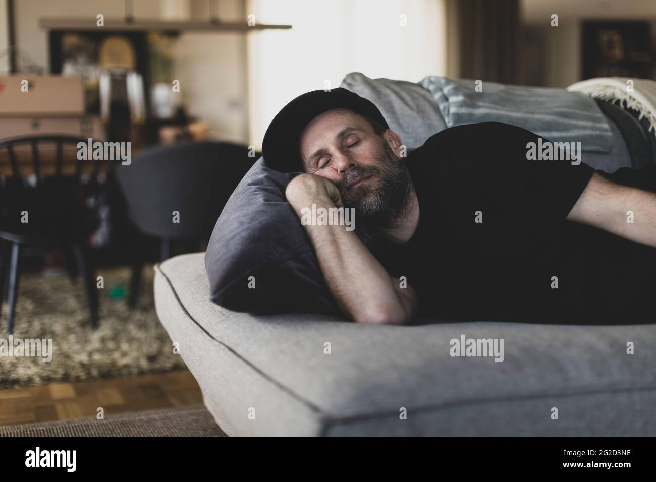 Mature man sleeping on sofa Stock Photo - Alamy