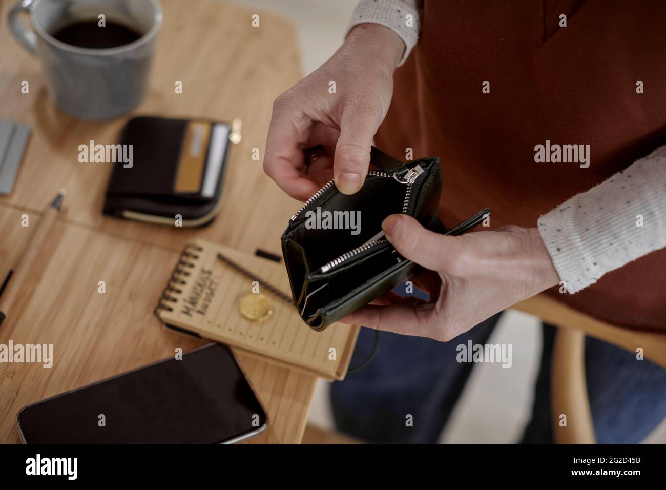 Man's hands holding wallet Stock Photo - Alamy