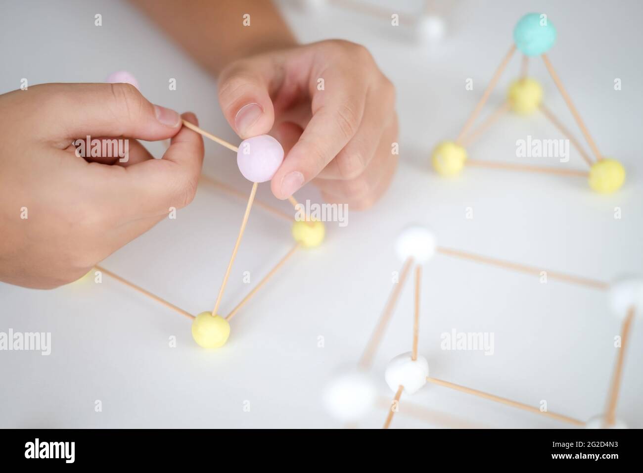 STEM education, Child learning making 3D geometric shapes, Building ...