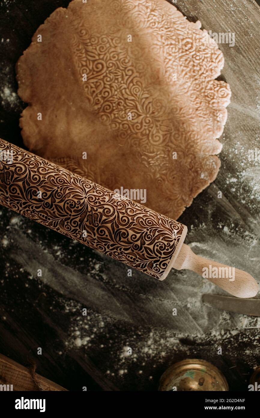 Carved rolling pin Stock Photo - Alamy