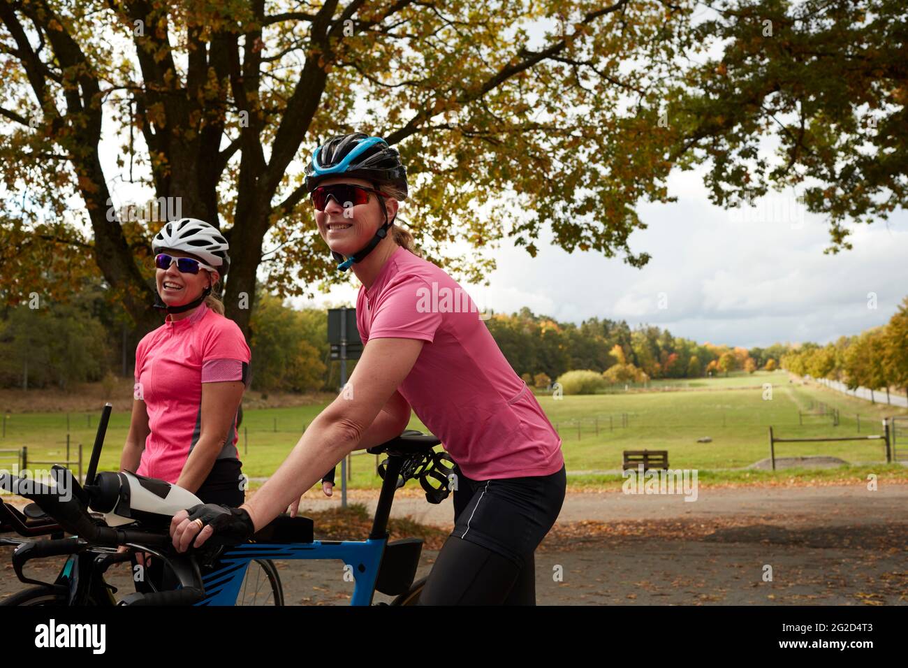 cyclists relaxing on roadside Stock Photo - Alamy