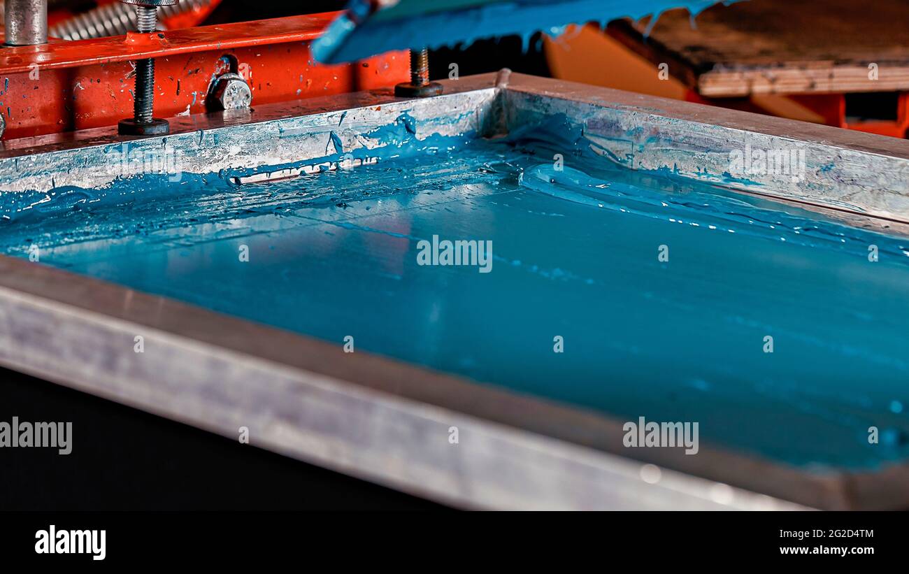 selective focus photo of blue ink on a frame for serigraphy production ...