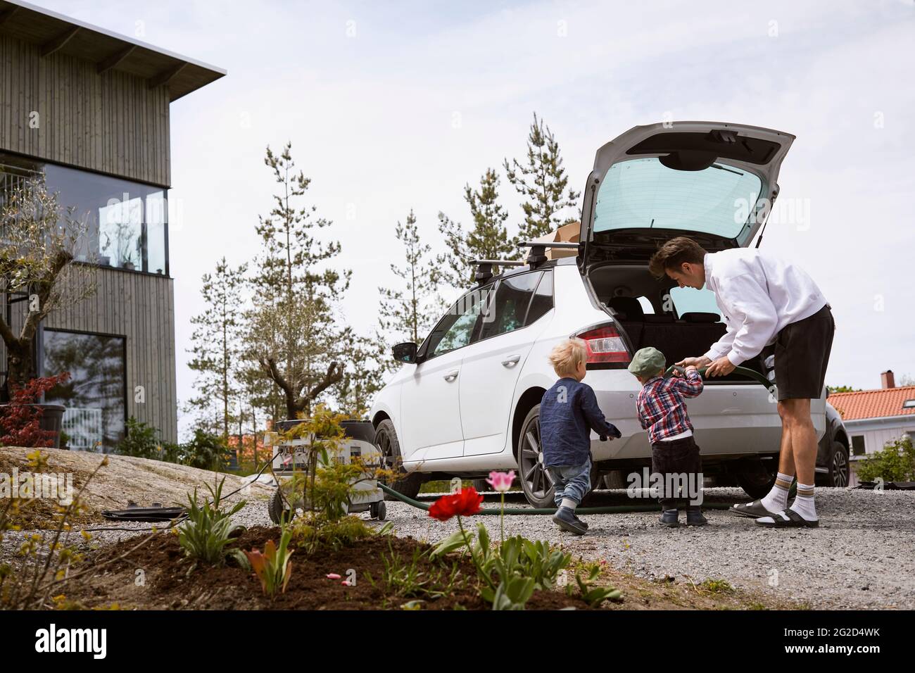 Man vacuuming car boot Stock Photo - Alamy