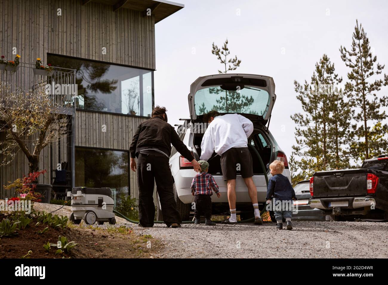 Man vacuuming car boot Stock Photo - Alamy