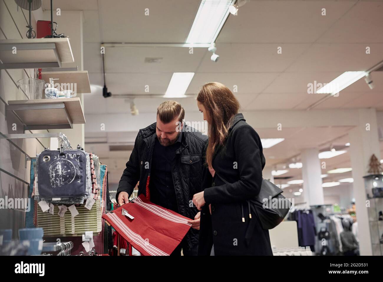 Couple shopping in department store Stock Photo - Alamy
