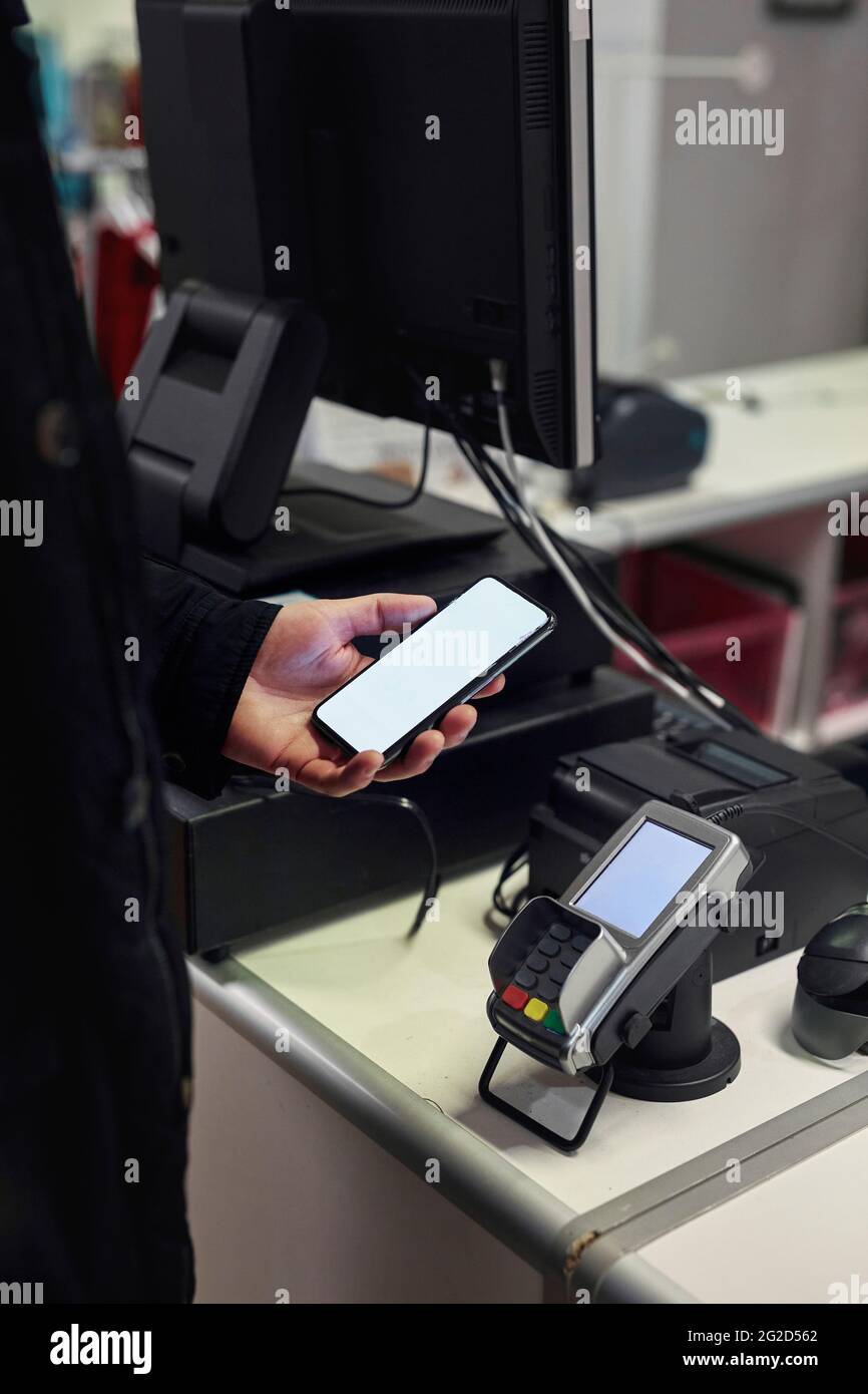 Man paying in department store Stock Photo - Alamy