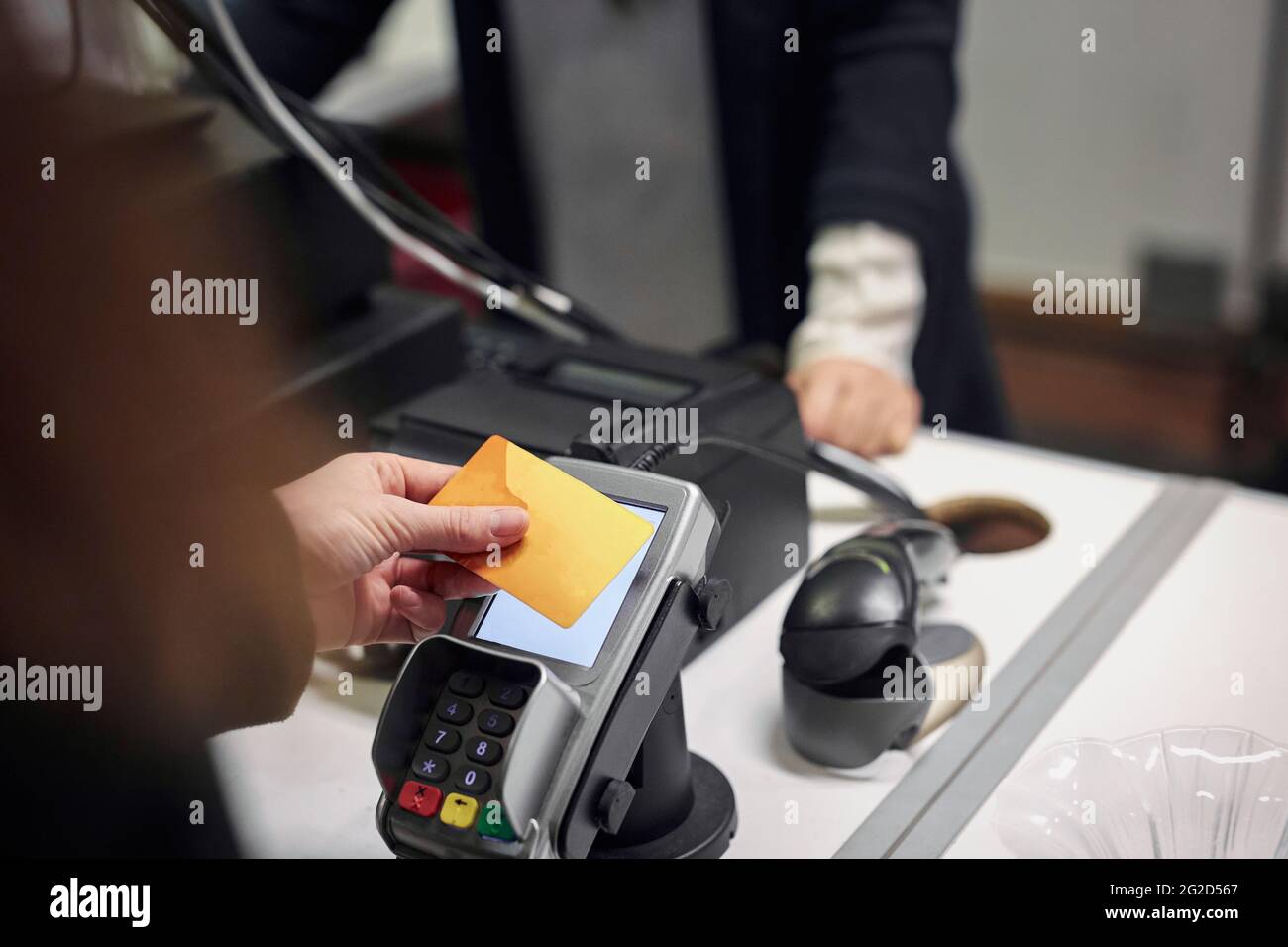 Man paying in department store Stock Photo - Alamy