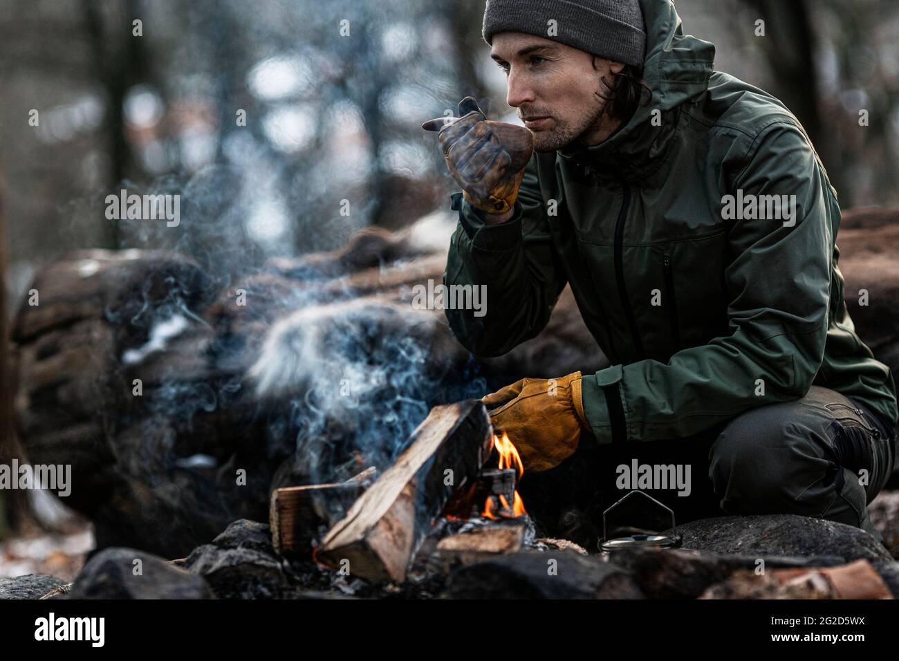 Man sitting fire drink hi-res stock photography and images - Alamy