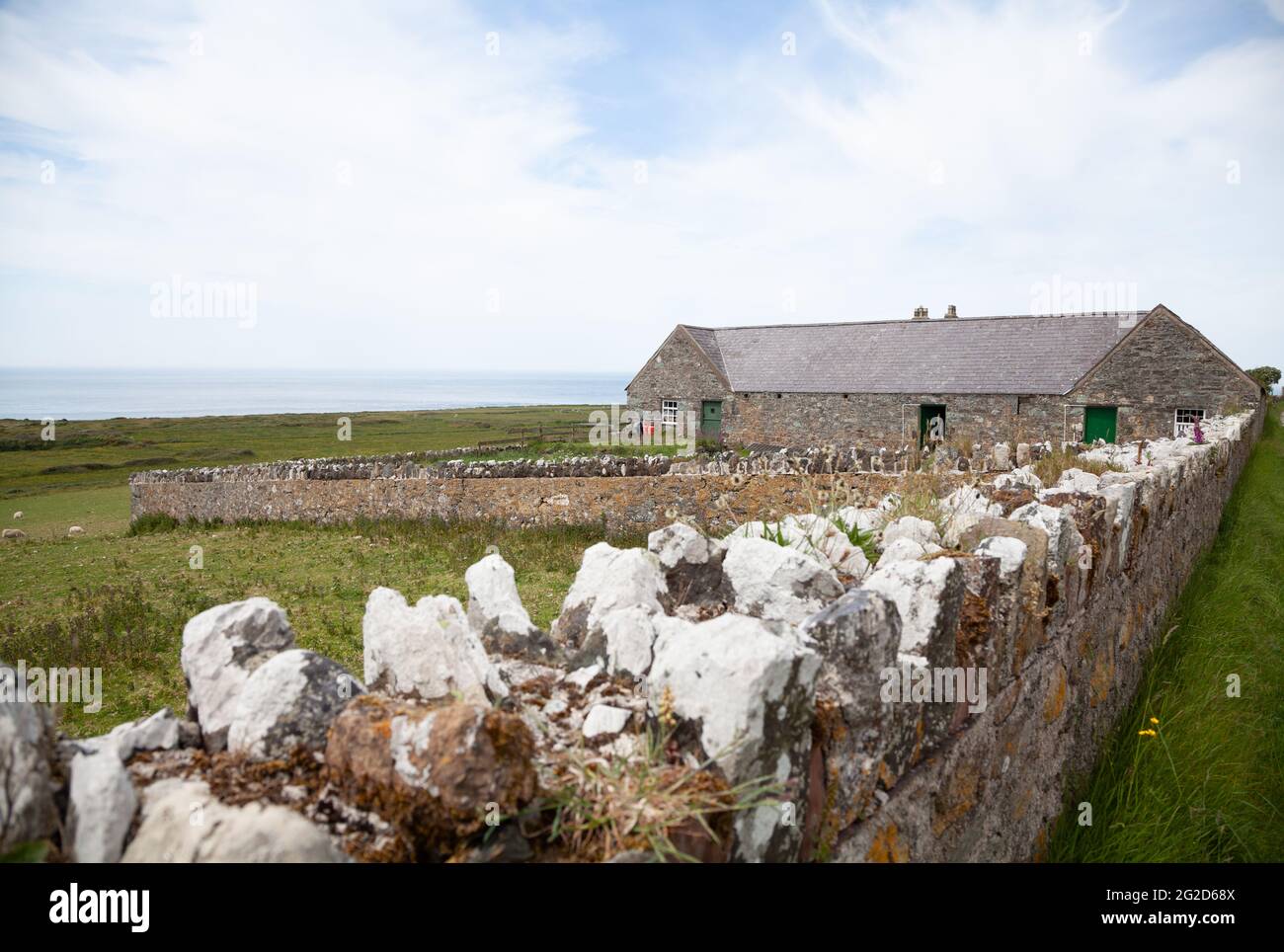 Range of stone built farm buildings on Ynys Enlli / Bardsey including ...