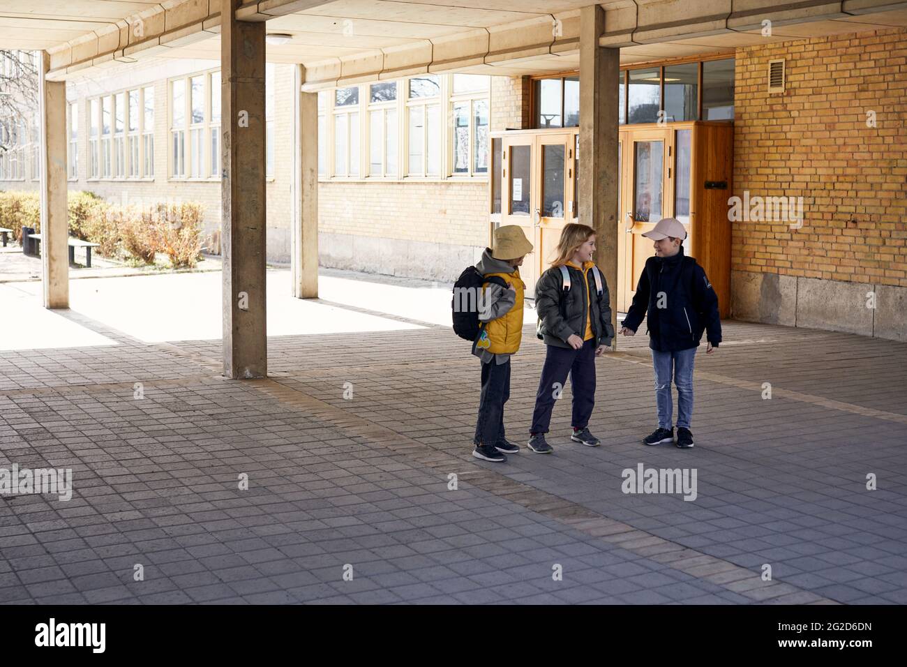 Children standing in front of school Stock Photo - Alamy