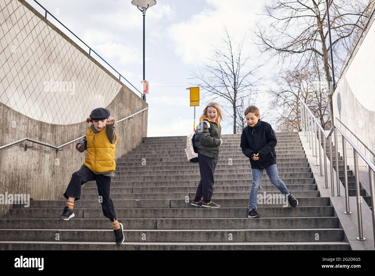 Children jumping on stairs Stock Photo - Alamy