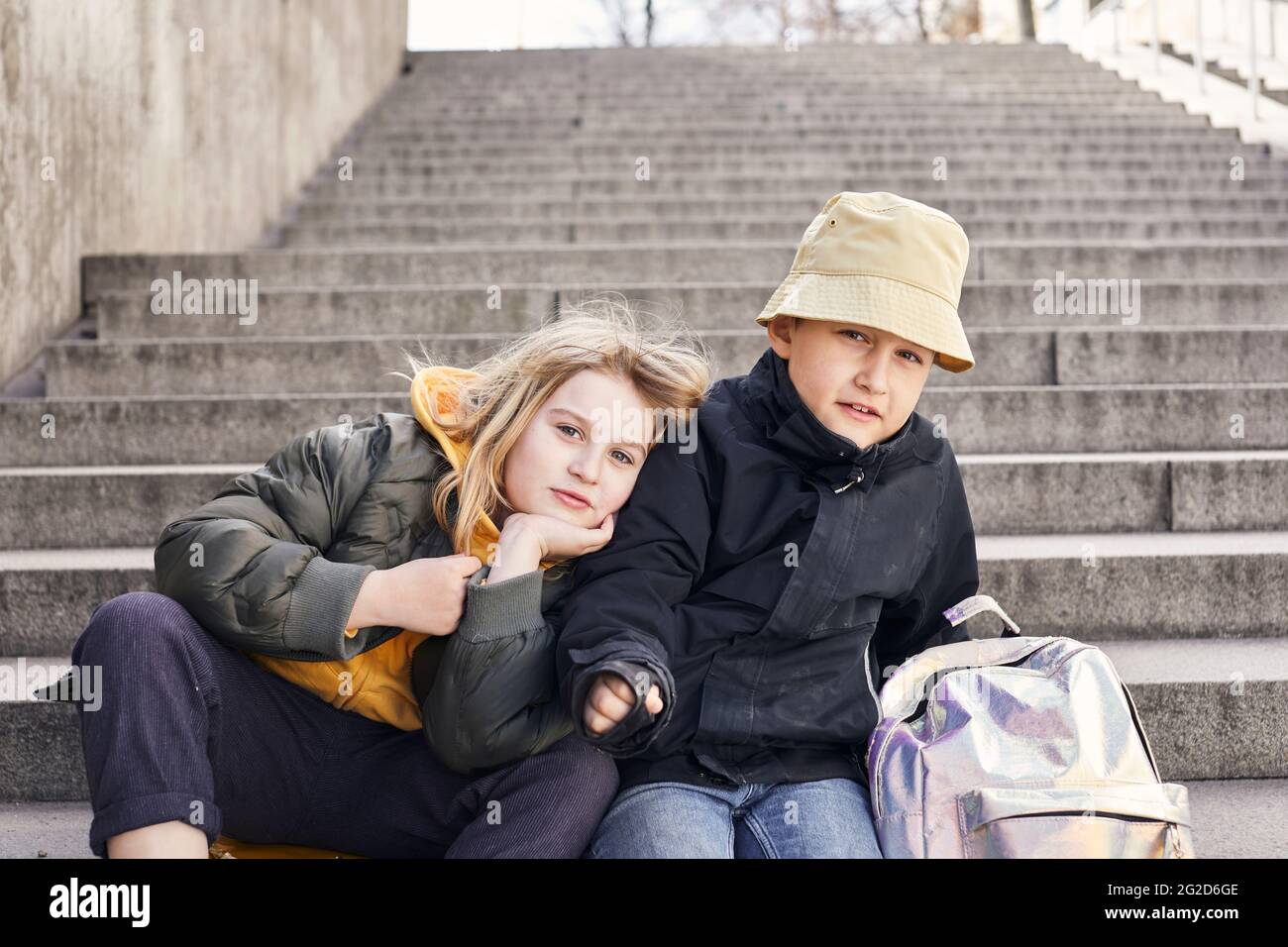 Boy girl sitting stairs hi-res stock photography and images - Alamy