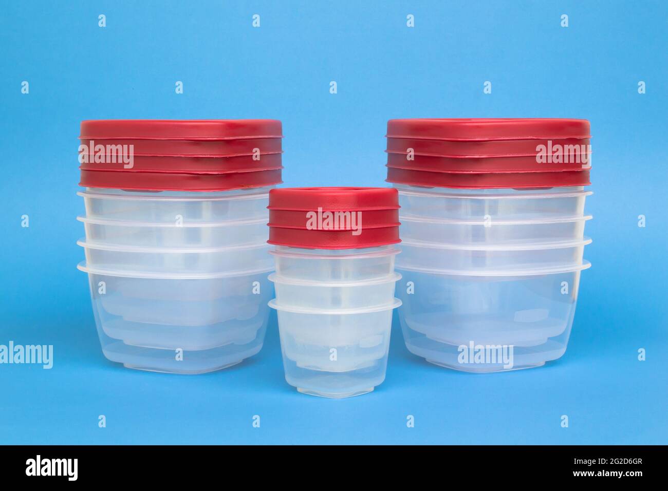 Food preservation containers with red lids on blue Stock Photo - Alamy