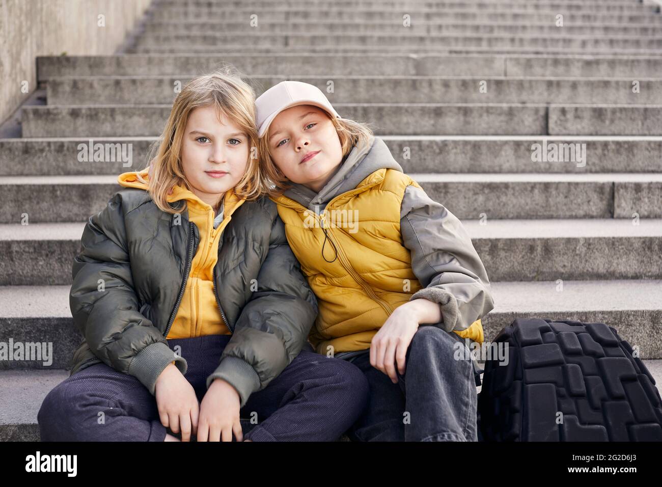 Two sisters sitting on stairs hi-res stock photography and images - Alamy