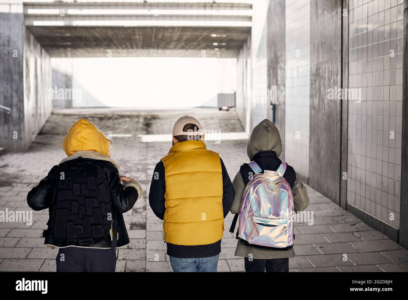 Rear view of children walking together Stock Photo - Alamy