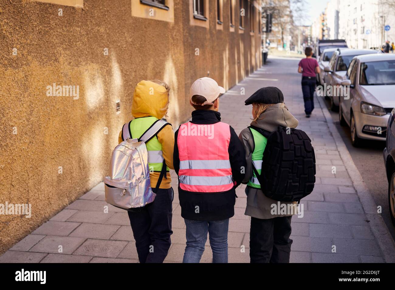 Rear view of children walking Stock Photo - Alamy