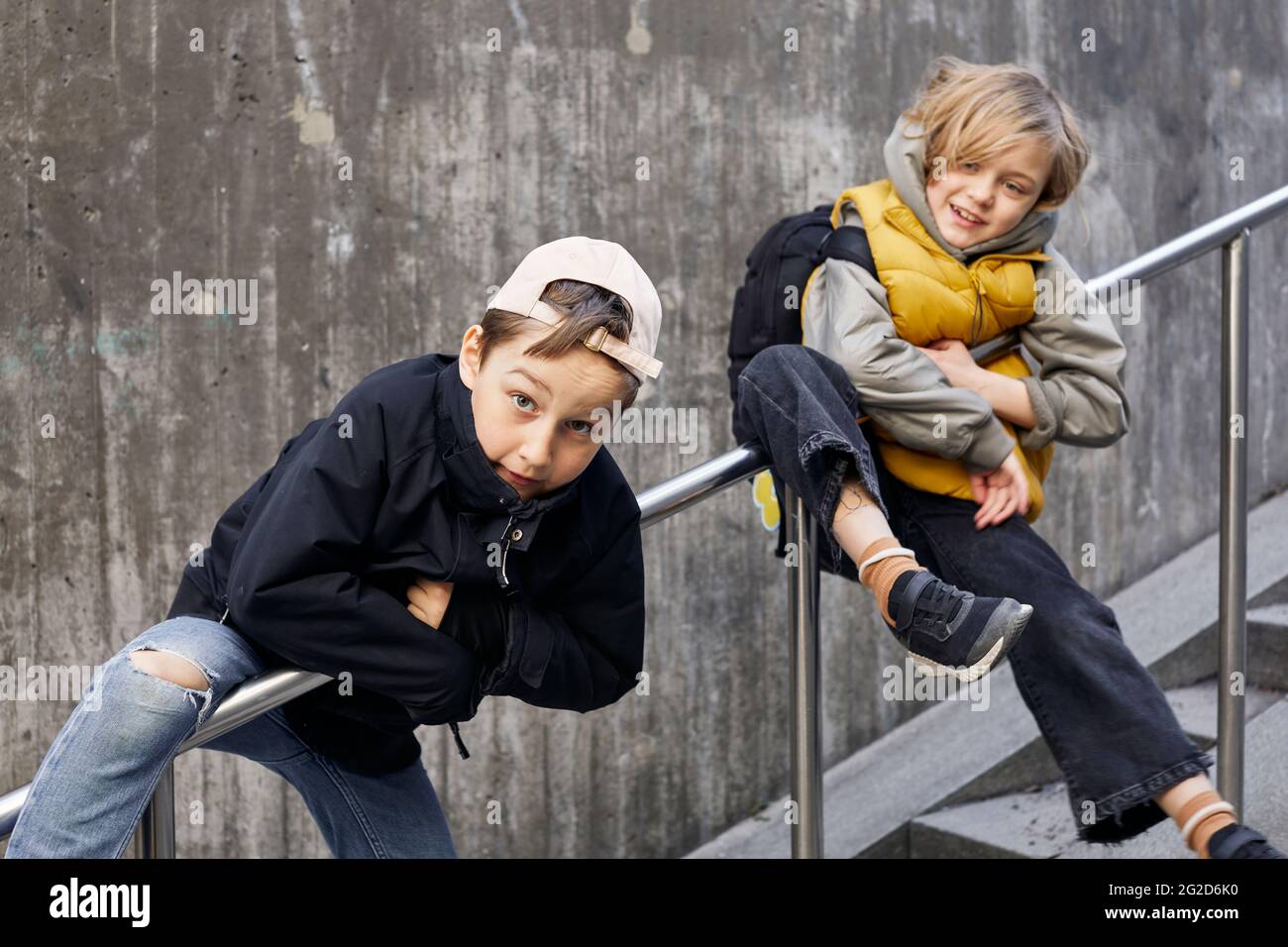 Children on stairs looking at camera Stock Photo - Alamy