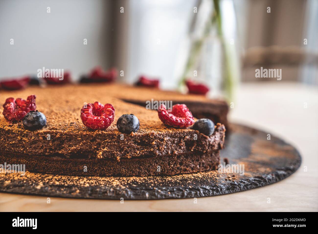 Chocolate cake on a table in a café Stock Photo - Alamy