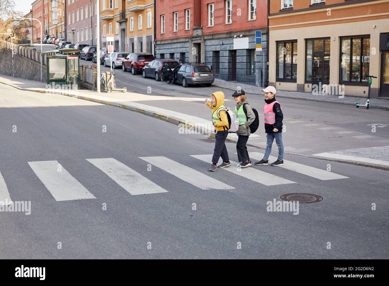 Children crossing road together Stock Photo - Alamy