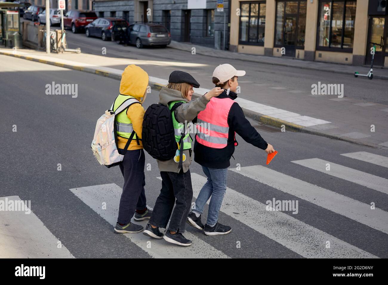 Children crossing road together Stock Photo - Alamy