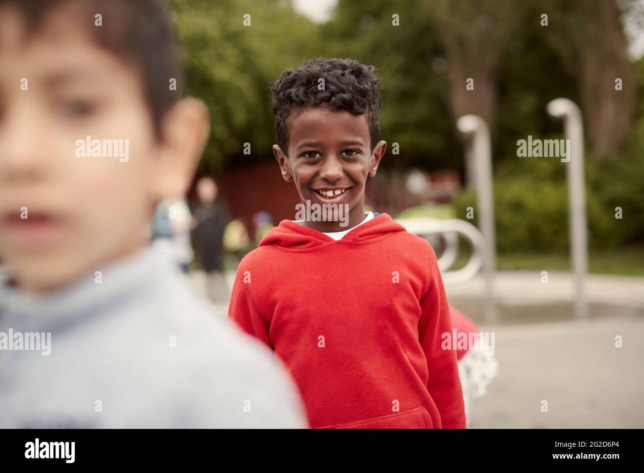 Smiling boy looking at camera Stock Photo - Alamy