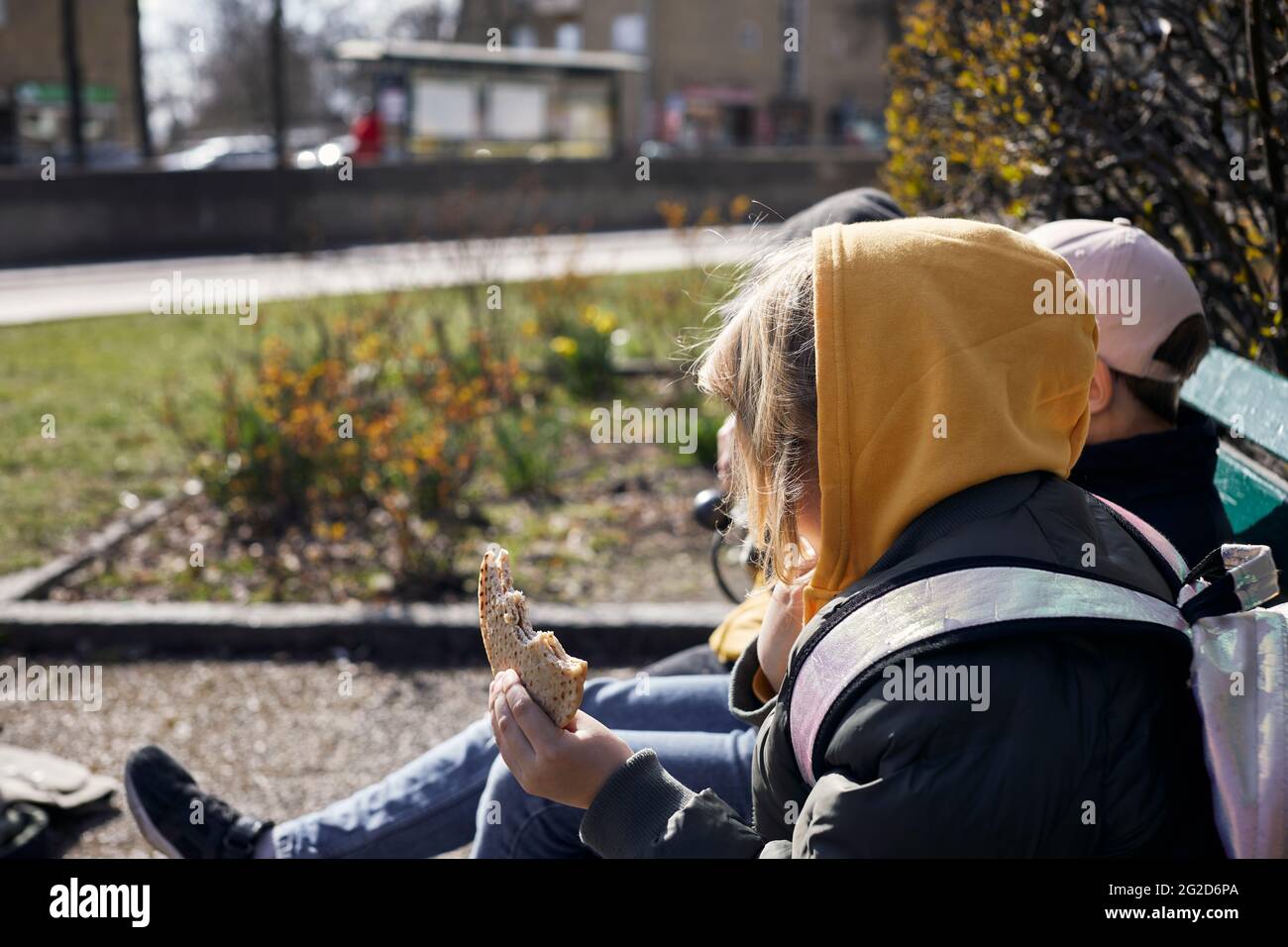 Girl eating sandwich Stock Photo - Alamy