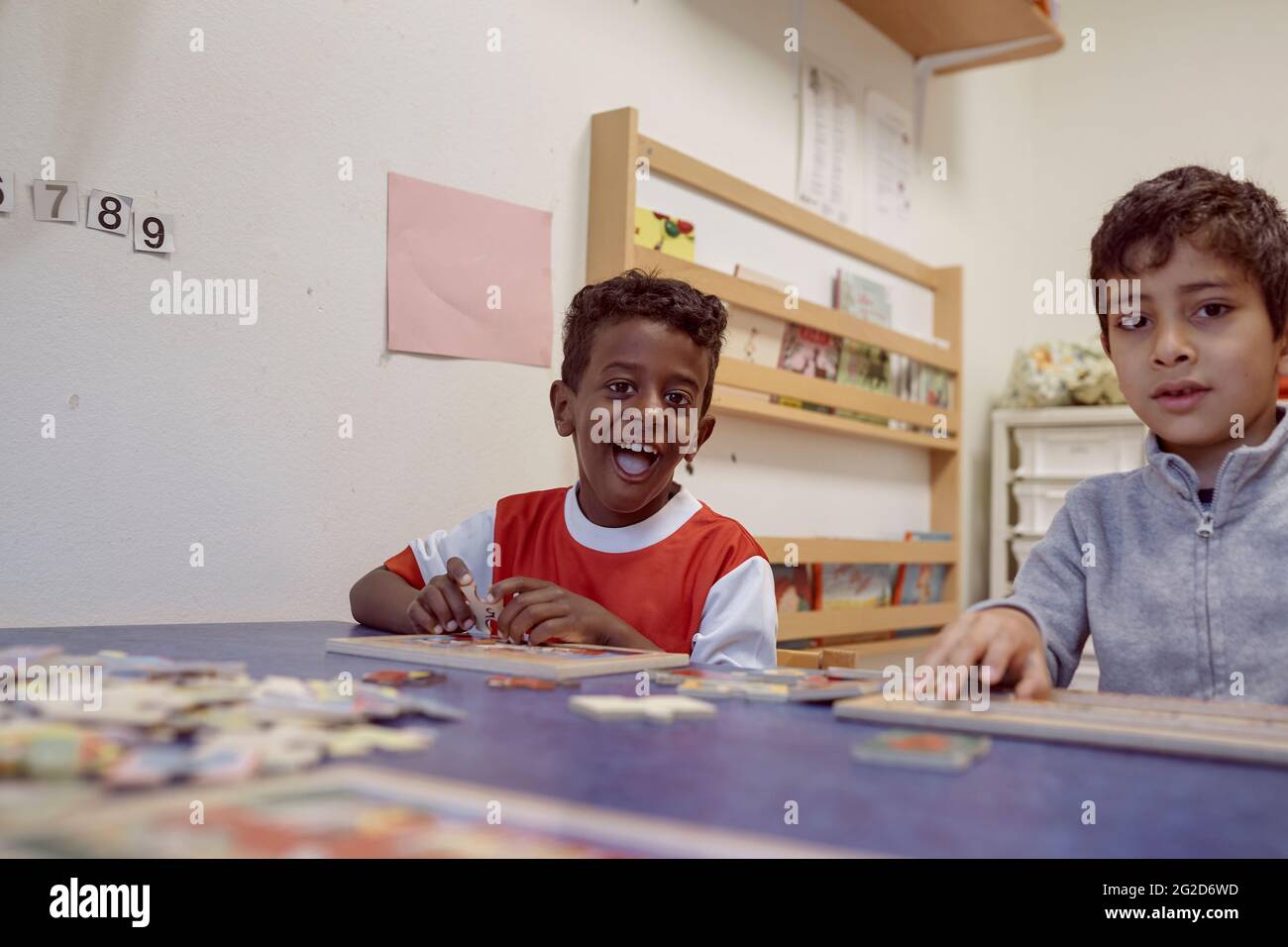 Smiling boys in classroom Stock Photo - Alamy