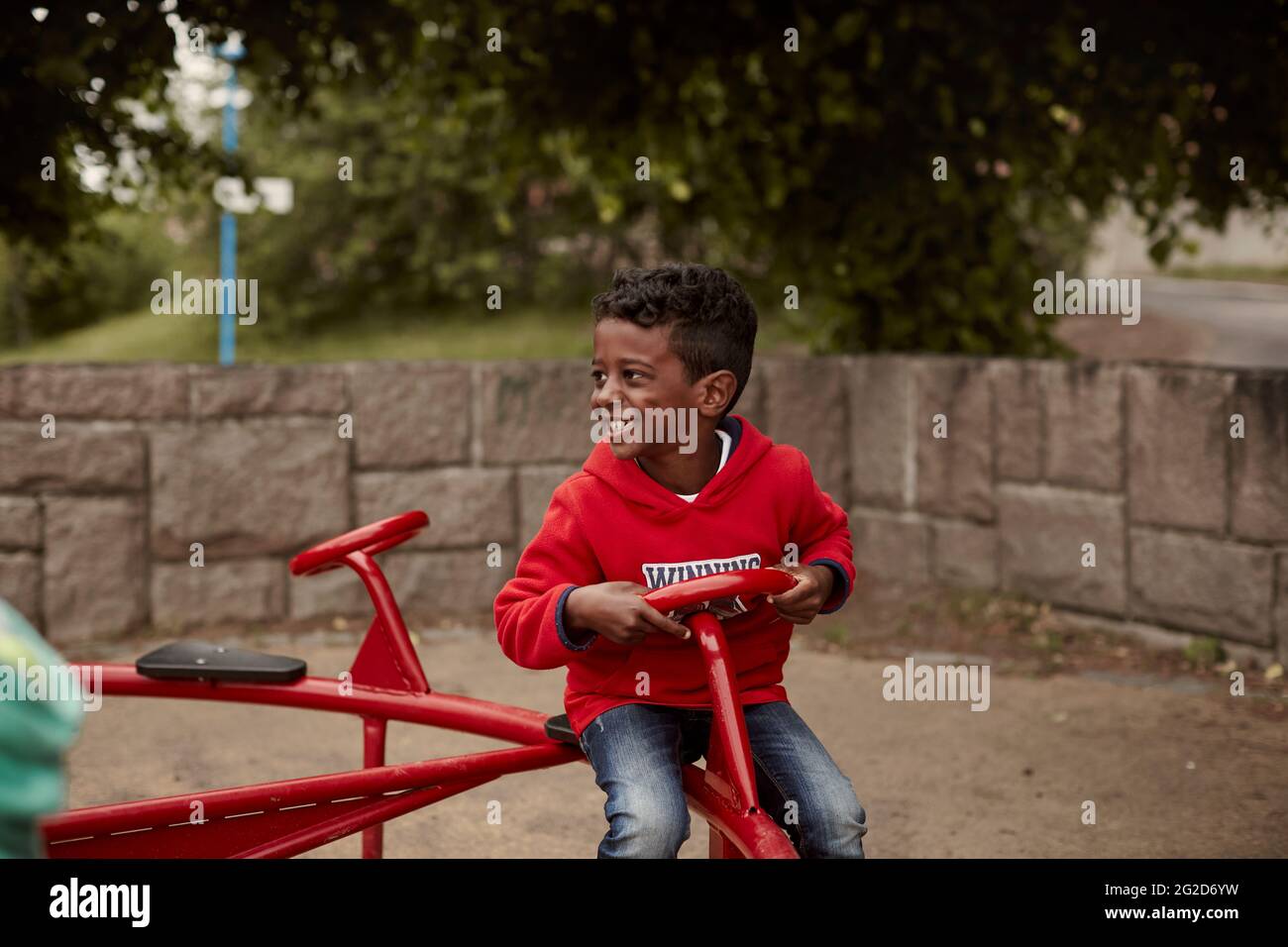 Children spinning playground hi-res stock photography and images - Alamy