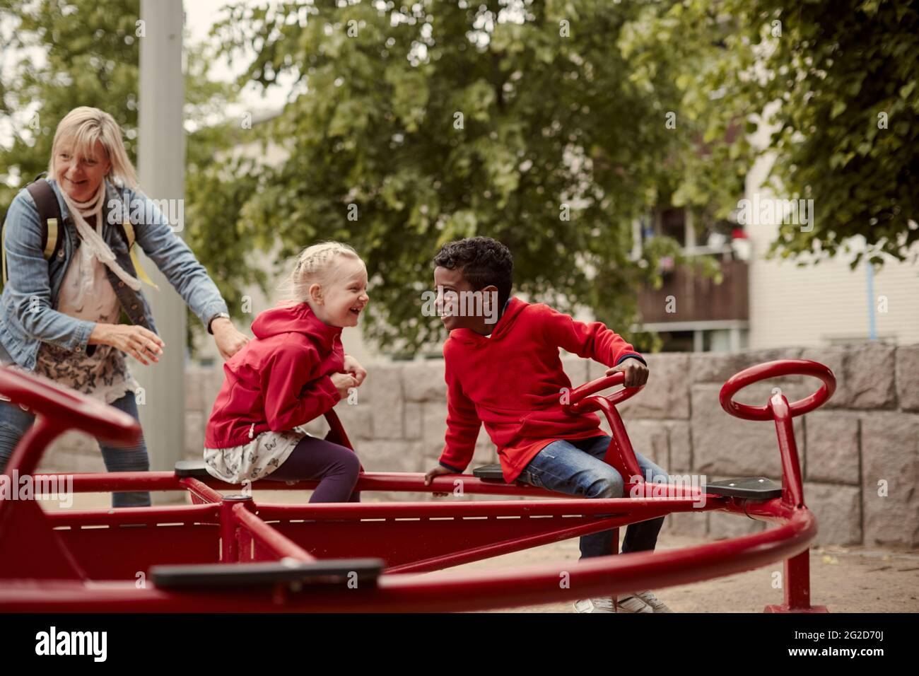 Children spinning playground hi-res stock photography and images - Alamy