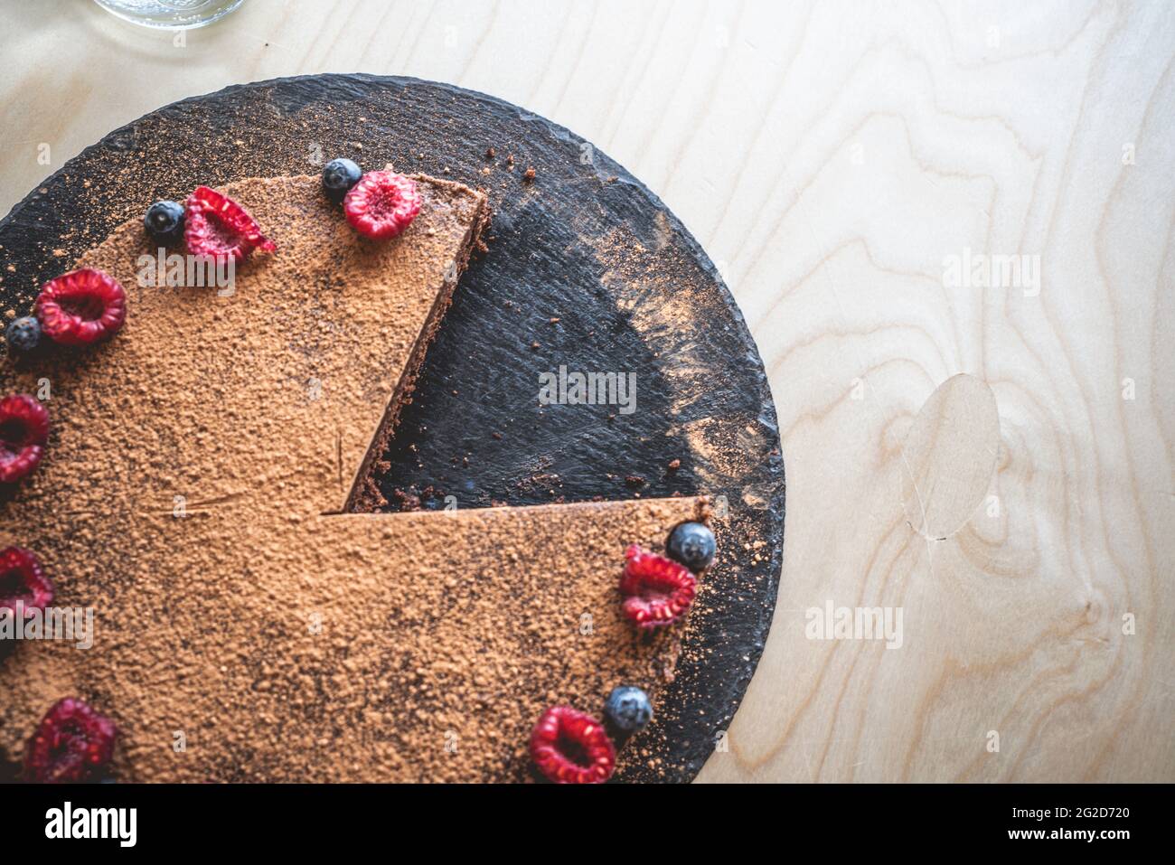 Chocolate cake on a table in a café Stock Photo - Alamy