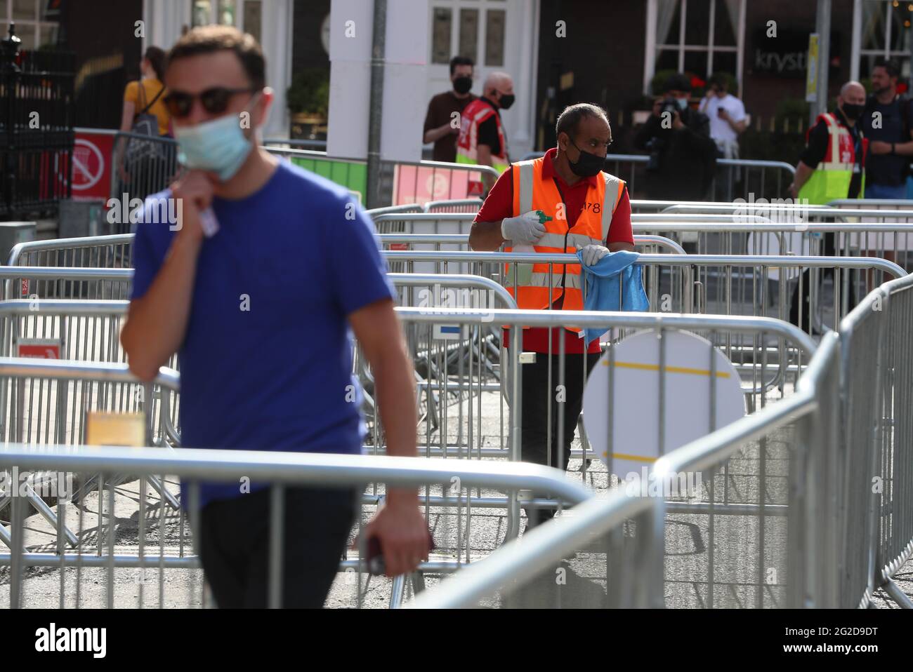 The barriers are wiped down as people arrive to attend Ireland's first ...